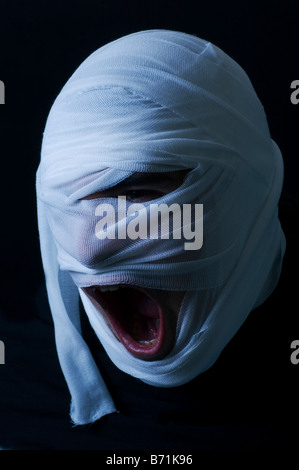 A man with his face wrapped in bandage Stock Photo - Alamy