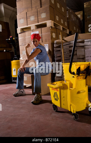 Janitor with mop bucket in storage warehouse Stock Photo - Alamy