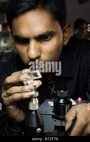 Workers in a diamond cutting workshop in Surat City, Gujarat. India ...