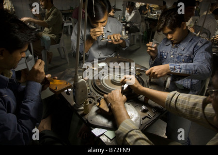 Workers in a diamond cutting workshop in Surat City, Gujarat. India ...