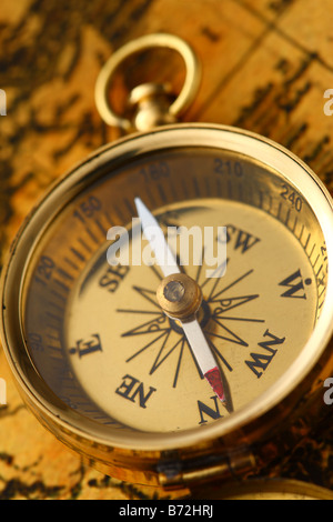 Antique golden compass and old map Stock Photo - Alamy