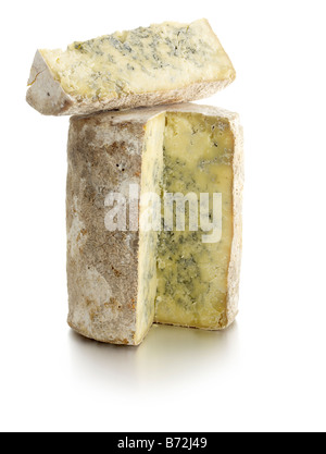 A slice of blue aged Stilton cheese on a wooden table. Cheese is served ...