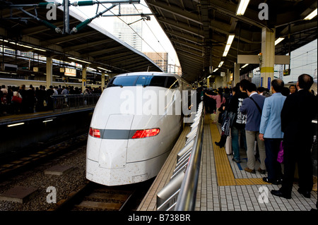 300 series Shinkansen train arriving at a railroad station, Tokyo ...