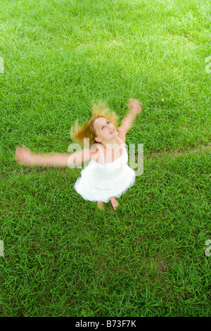 Blond woman throwing her head back Stock Photo - Alamy