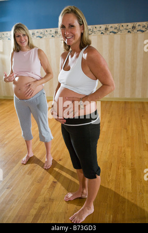 Comparing two bellies Stock Photo - Alamy