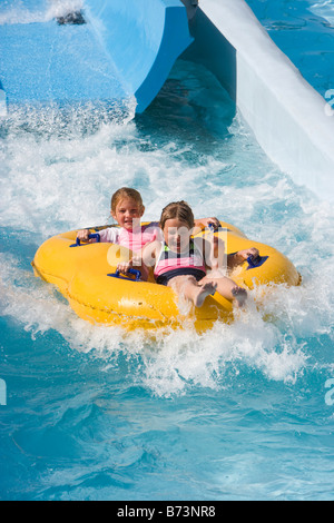 Family and friends floating on innertubes at a water park Stock Photo ...