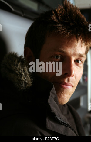 Handsome man wearing winter coat cheerful with a smile of face pointing ...