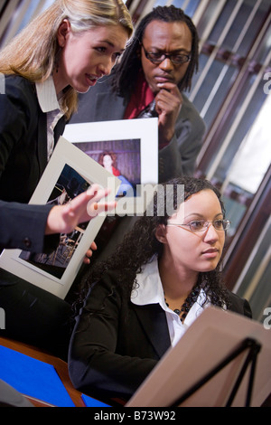 Business team working on their project together at office Stock Photo ...