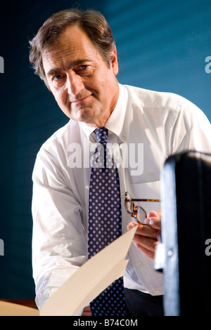 Close-up portrait of executive business people standing in a row at ...