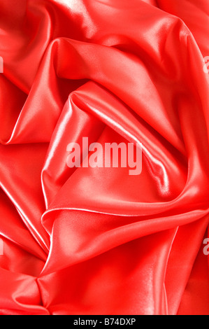 Red satin or silk abstract background with wave pattern Stock Photo - Alamy
