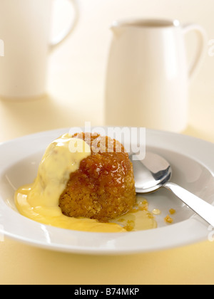 Bowl Of Steamed Syrup Pudding With Jug Of Custard Stock Photo - Alamy