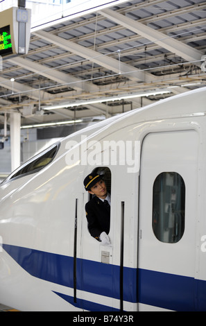 A female train guard on the Shinkansen bullet train Stock Photo - Alamy
