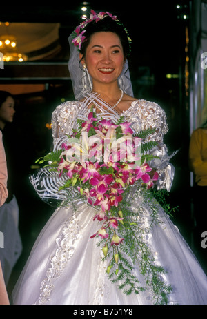 Portrait of romantic woman with bouquet of red roses on blurred green ...