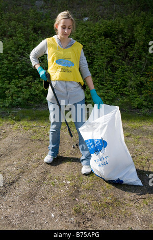 Young woman helps with community clean-up, Vancouver, Canada Stock ...