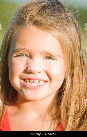 Portrait of caucasian girl of six years looking at camera on white ...
