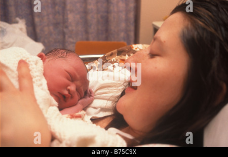 mother holding newborn baby immediately after birth Stock Photo - Alamy
