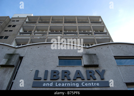 sign for library and learning centre adjacent to a towerblock on the ...