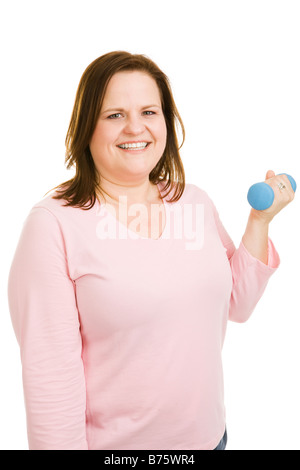 Beautiful plus sized model working out with free weights and a pilates ...