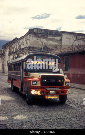Colourful chicken bus in the Spanish colonial-era city centre, Antigua ...