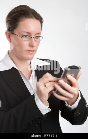 Compaq IPAQ personal digital assistant in USB cradle, an early pocket ...