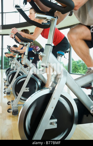 Five people at spinning class Stock Photo - Alamy