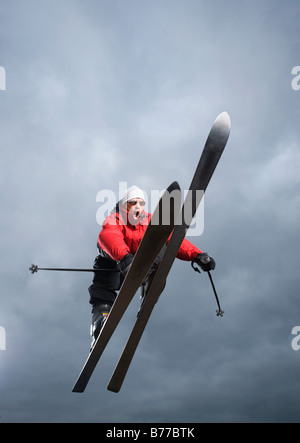 Mid adult male skier mid air, Obergurgl, Austria Stock Photo - Alamy