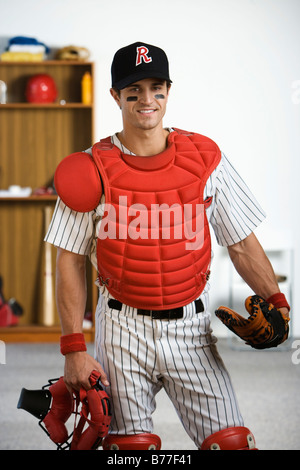 Baseball player bare chest posing locker room Stock Photo - Alamy