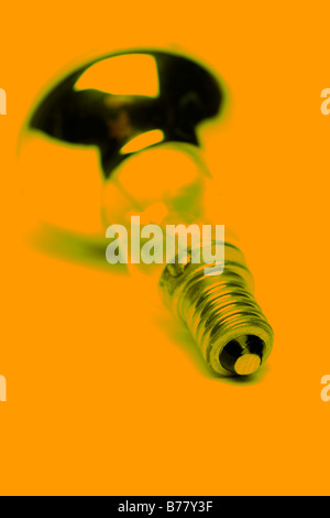 Closeup shot of a light bulb on a dark blue background Stock Photo - Alamy