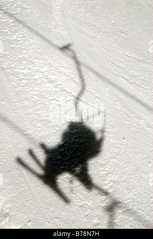 Chair ski lift with skiers silhouettes at sunset Stock Photo - Alamy