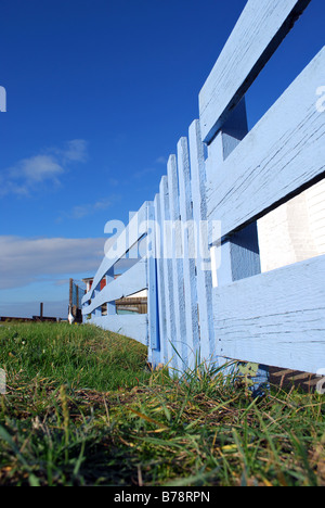 Fence disappearing into distance Stock Photo - Alamy