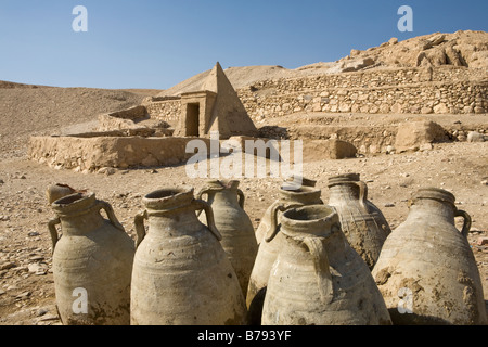 Water jars standing in front of a Pyramid tomb at Deir el Medina: The ...