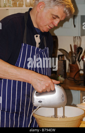 Man cook preparing cake in kitchen at home Stock Photo - Alamy