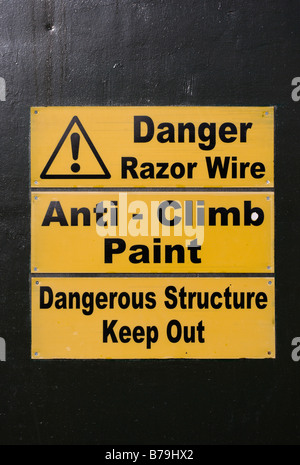 Sign warning of a dangerous building and to keep out. The building ...