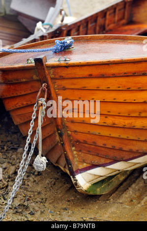 beached boats stranded on muddy sand at low tide Stock Photo - Alamy