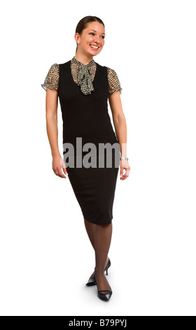 Happy woman looking away while standing on city street Stock Photo - Alamy