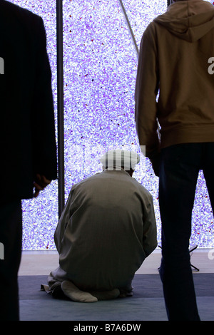Islamic photo. Muslim man praying with Holy Quran on background ...