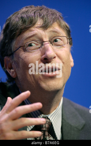 A man in glasses looks seriously at a laptop screen, works at a ...