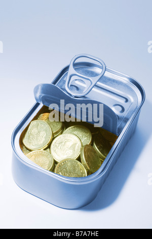 Savings cans and coins Stock Photo - Alamy
