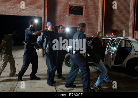 Police Officers Arresting Suspects Stock Photo - Alamy