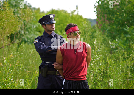 Police Officer Arresting Suspect Stock Photo - Alamy
