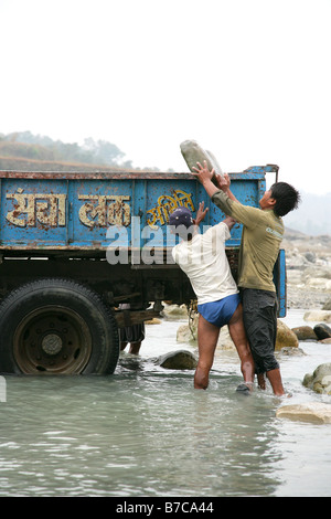 “Men hand quarrying stone on the Seti River nepal Stock Photo - Alamy