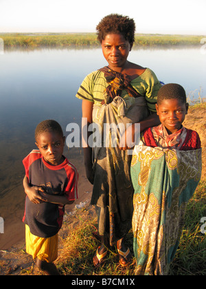 Woman of Bemba tribe with baby selling charcoal on Luapula or Congo ...
