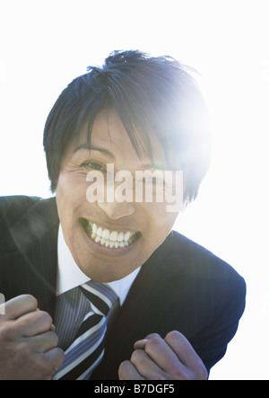 Businessman with victory pose Stock Photo - Alamy