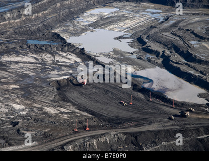 An aerial view of active bitumen open-pit mining in the Athabasca ...