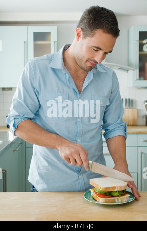 man making sandwich on the kitchen copy space Stock Photo - Alamy