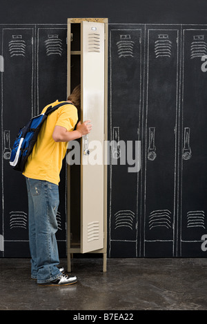 Boy in Locker Stock Photo - Alamy