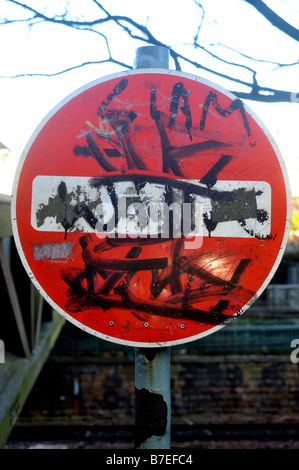 No parking sign covered with graffiti and stickers in Paris, France ...