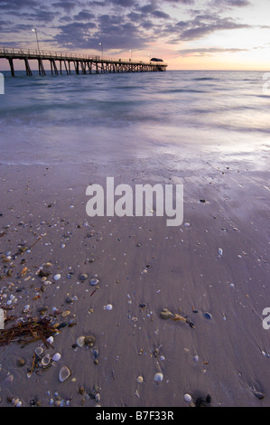 Henley Beach jetty at dusk with the tranquil sea embracing the ...