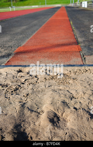 Runway and sand pit for a long jump Stock Photo - Alamy