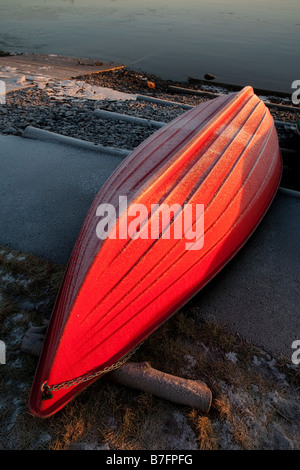 Bow of a red upturned fiberglass rowboat / skiff / dinghy Stock Photo ...